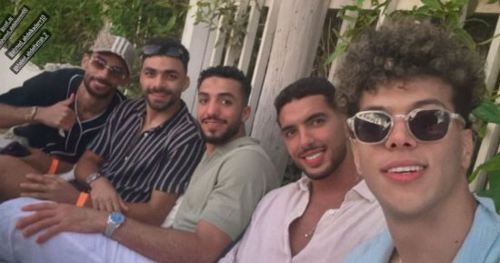 Imam Ashour Al-Ahli takes a photograph with the gamers and the group's ...